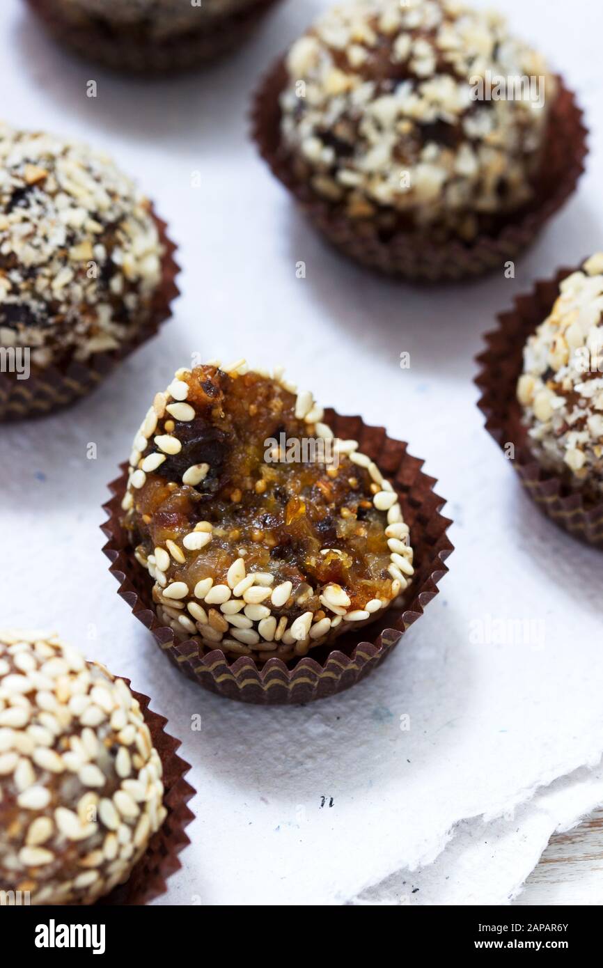 Homemade healthy candy made from dried fruits, honey and nuts. Rustic ...