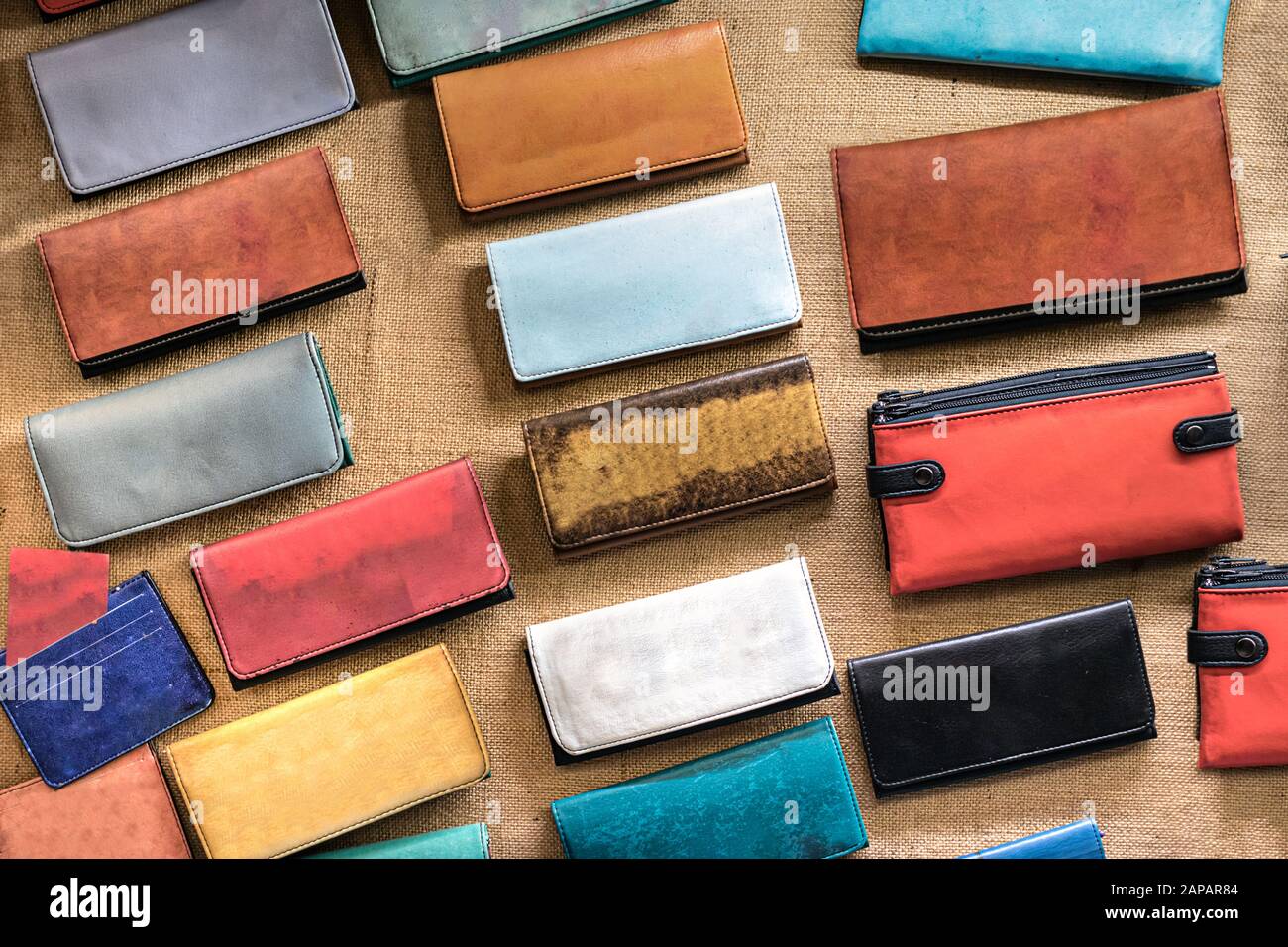 Group of leather wallets in different colours, top view Stock Photo - Alamy