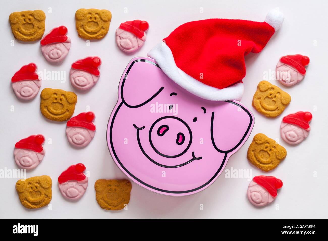 Percy Pigs tin of biscuits wearing Santa hat with Percy Pig biscuits ...