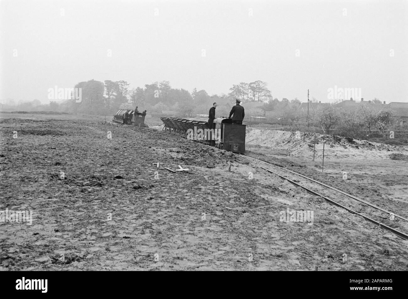 construction cemetery, workers, work, sand transport, tipping carts ...