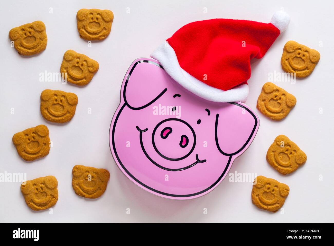 Percy Pigs tin of biscuits wearing Santa hat with Percy Pig biscuits ...