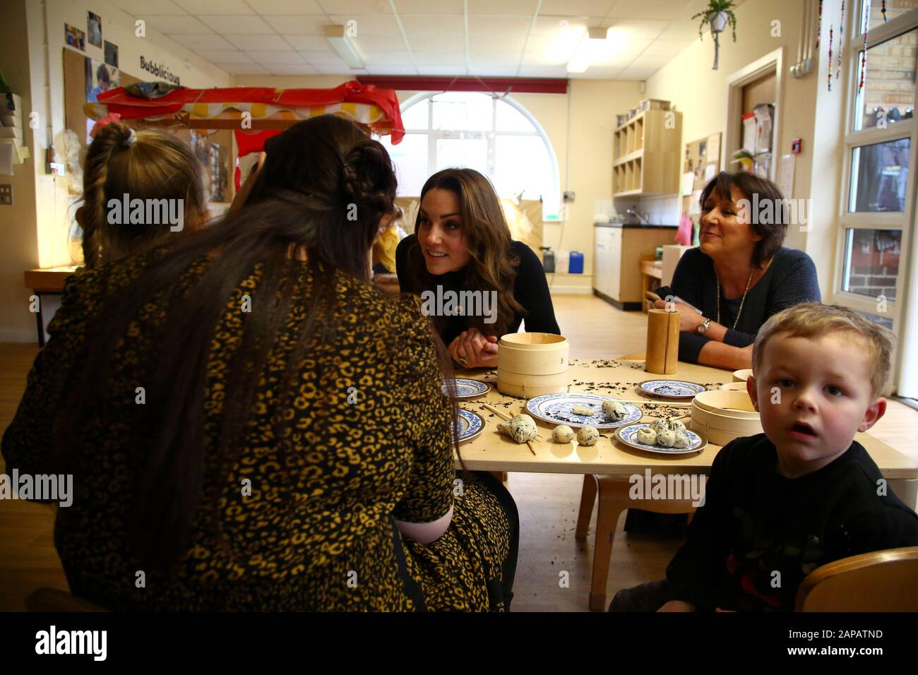 The Duchess of Cambridge chats with mothers and their children during a ...