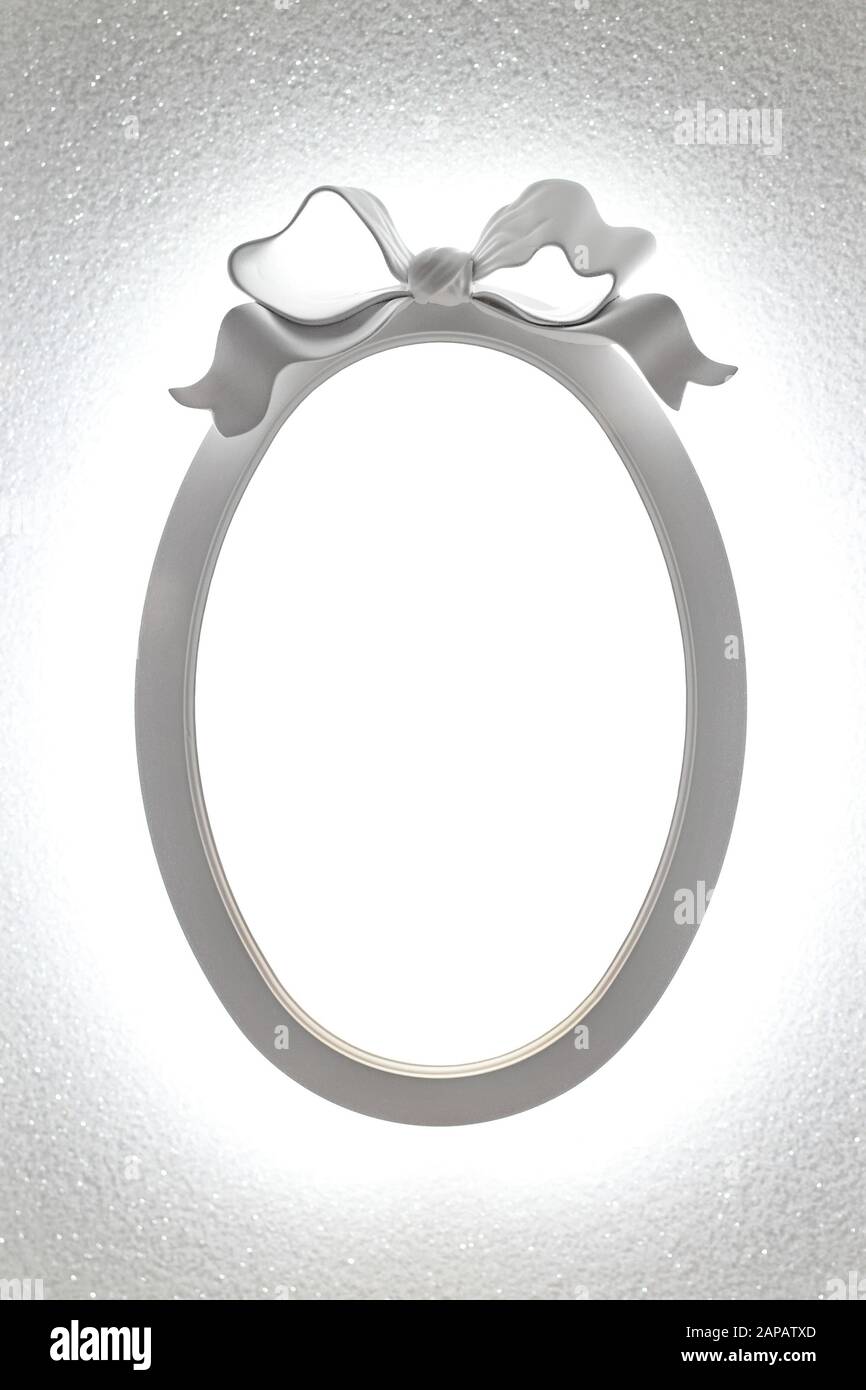 White oval frame with light and bow decor Stock Photo - Alamy