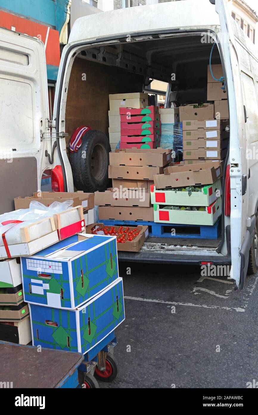 Boxes and crates of food in back of delivery van Stock Photo - Alamy
