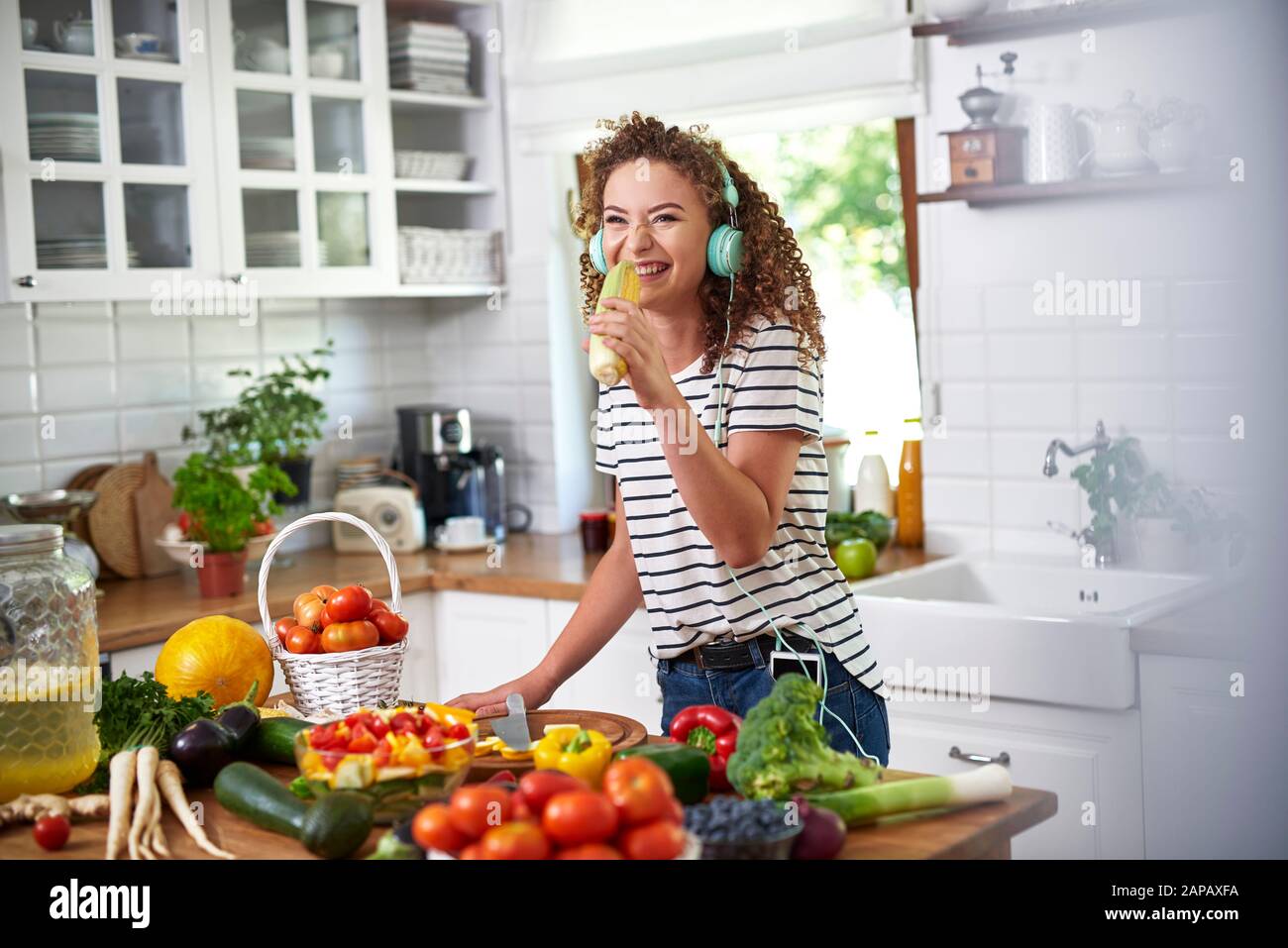 Woman singing headphones indoors hi-res stock photography and images ...