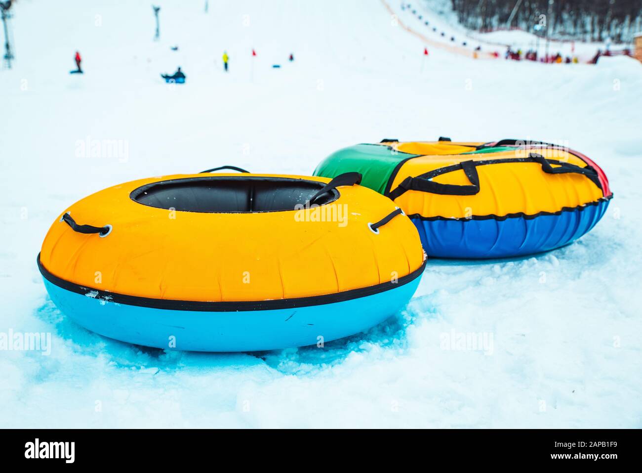 snow tubing rings close up. hill on background Stock Photo - Alamy