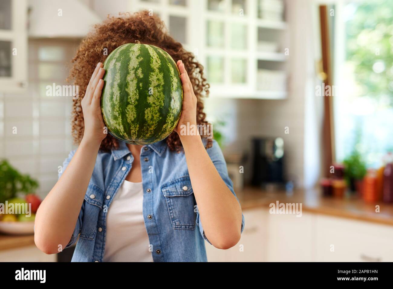 Funny face with ripe watermelon Stock Photo - Alamy