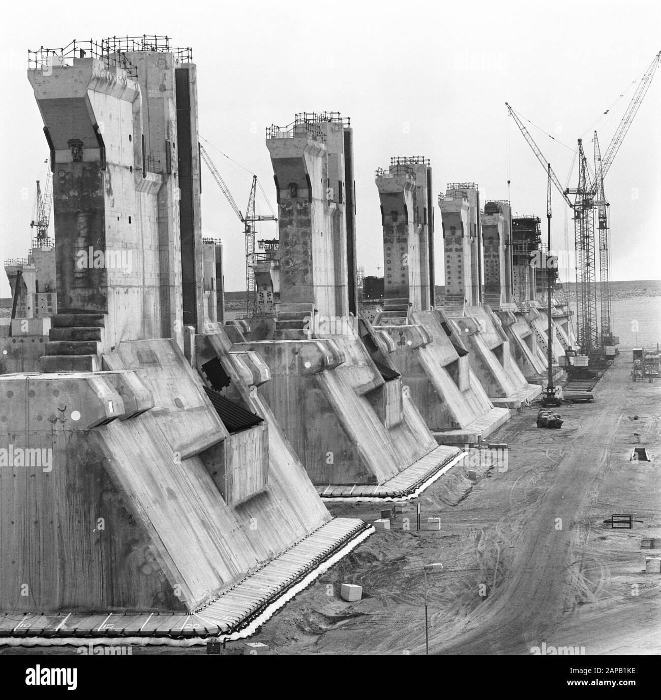 Construction storm surge barrier Oosterschelde, on the working island ...