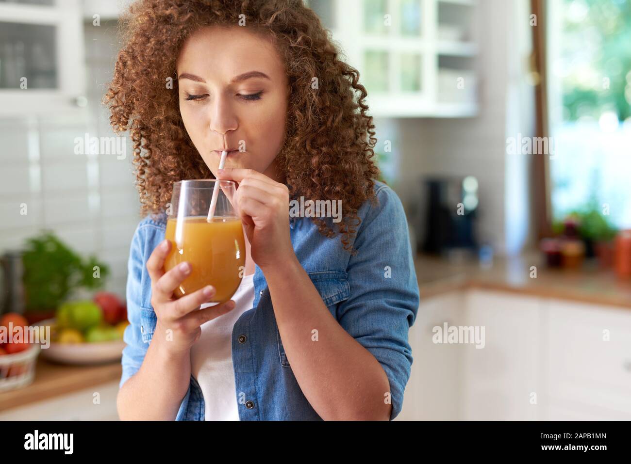 Woman summer orange fruit hi-res stock photography and images - Alamy