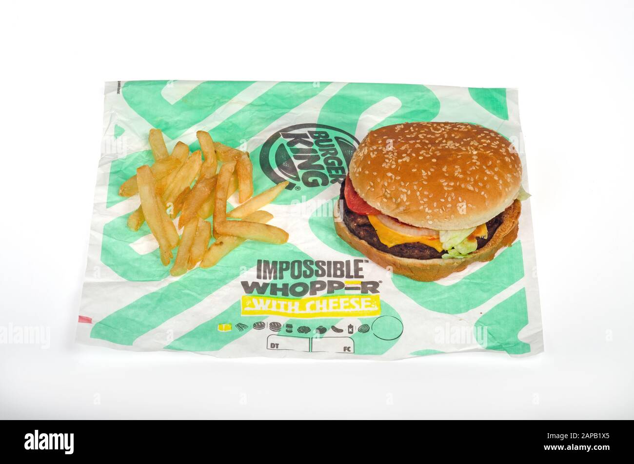 Burger King Impossible Whopper with fries on wrapper Stock Photo - Alamy