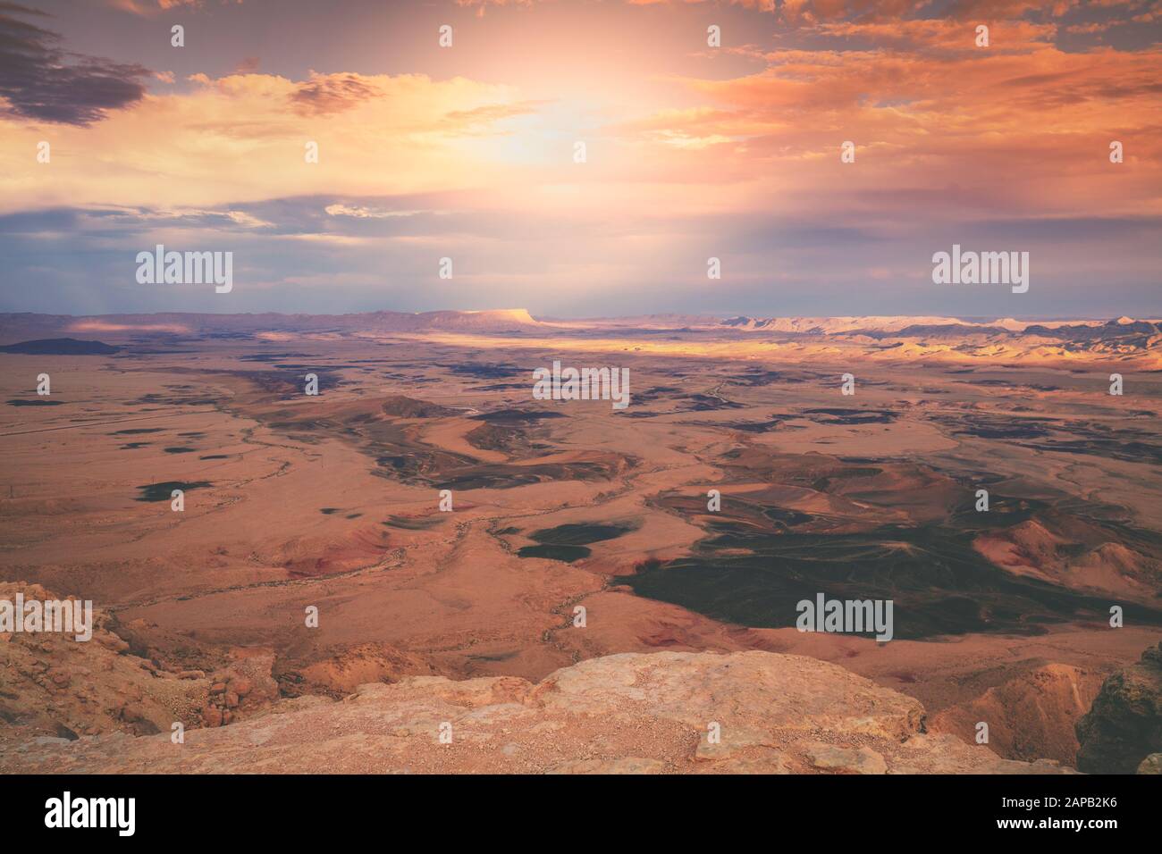 Beautiful dramatic sunset over the desert. Nature landscape. Makhtesh ...