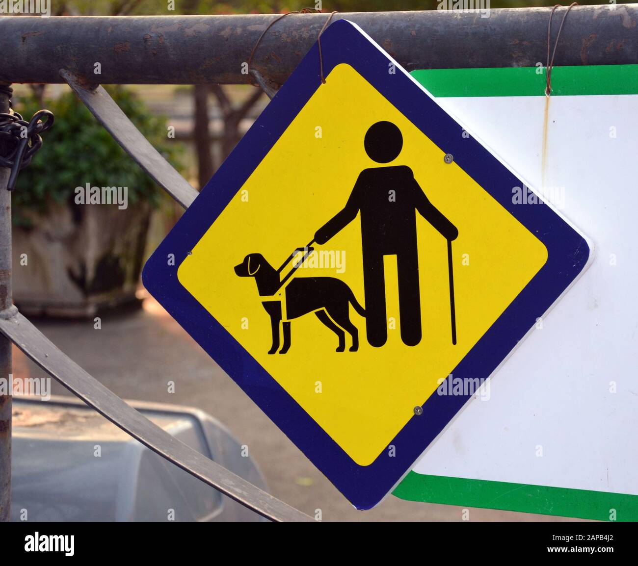 A sign indicates that people with guide dogs or assistance dogs are ...