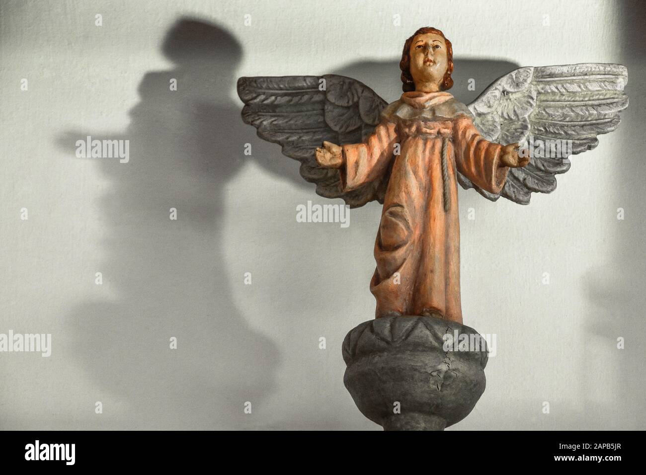 angel and shadow Stock Photo - Alamy
