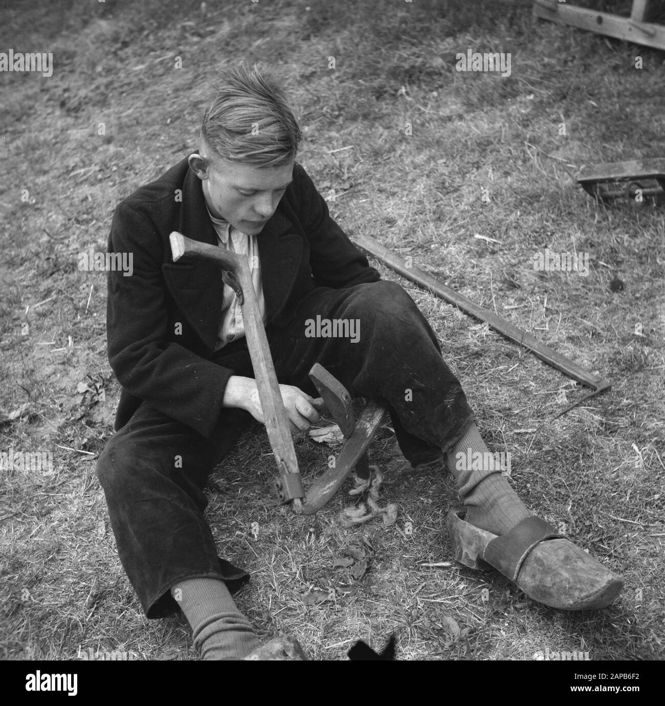 Annexation [Young man sharpens sickle with whetstone] Date: 1945 Stock ...