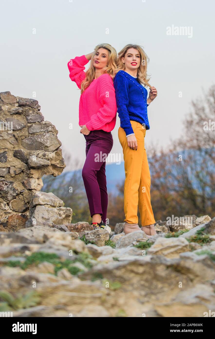 Autumn fashion. pretty fashion models outdoor. girls in knitted sweater ...