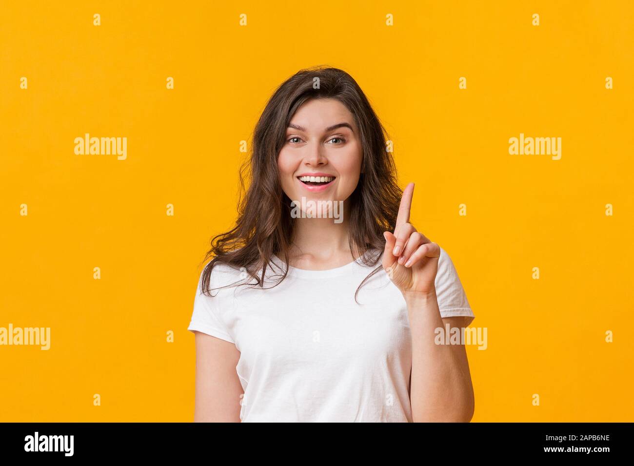 Young Woman Having Idea, Pointing Finger Up, Found Problem Solution ...