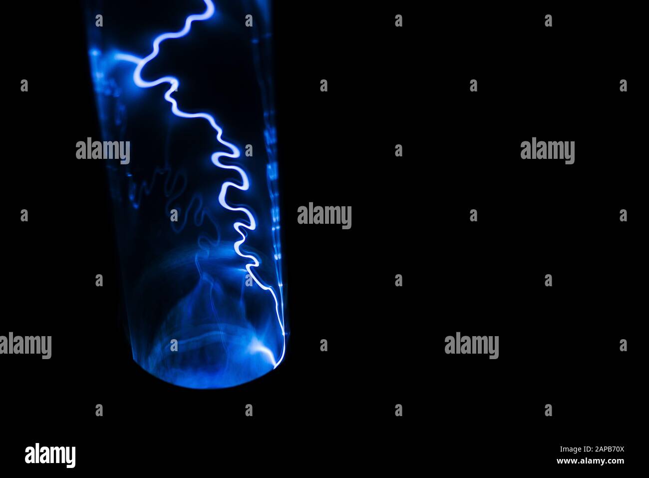 Lightning blue on a black background. Natural magic light effect ...