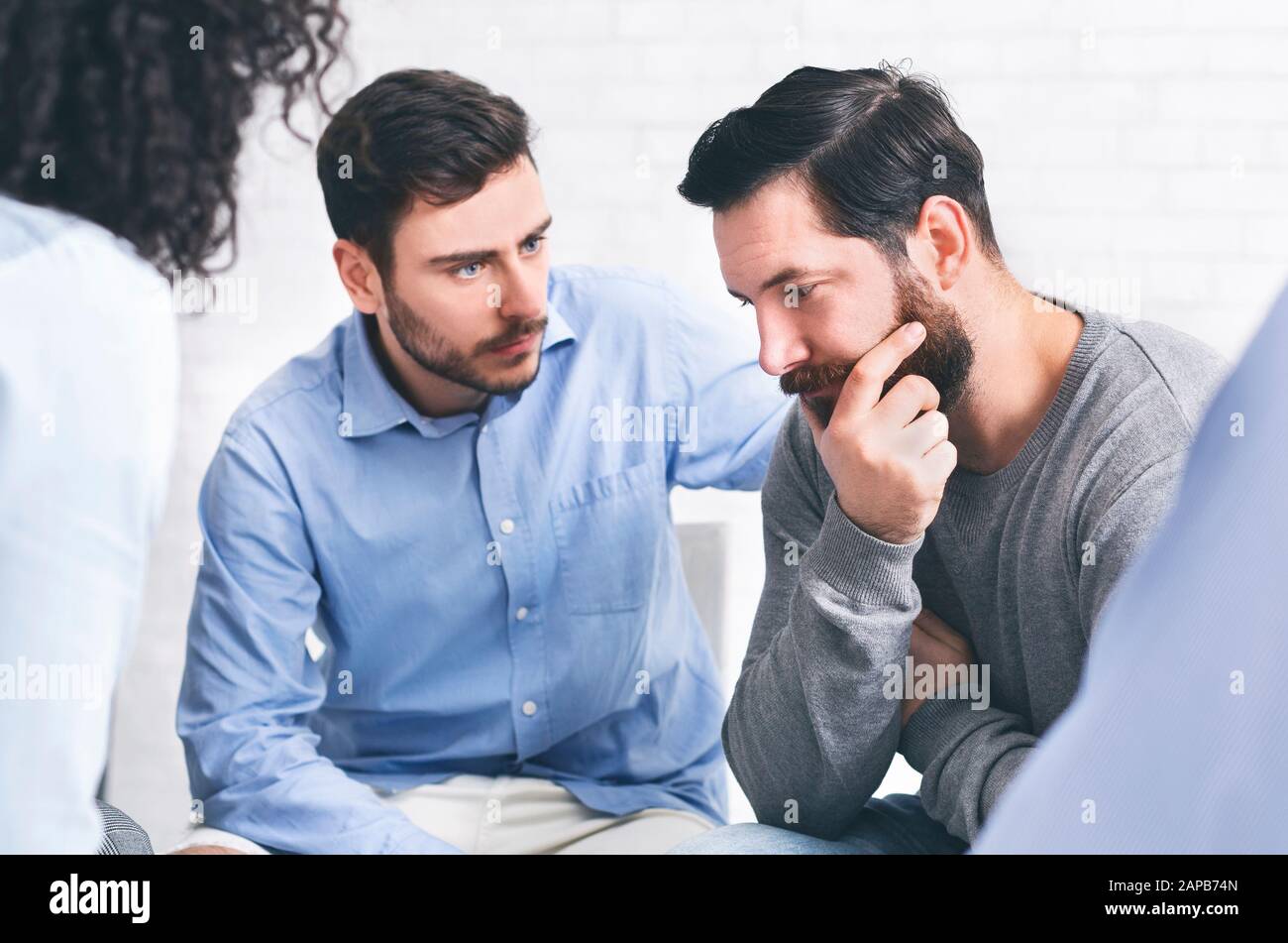 Understanding people giving support to depressed man at group therapy ...