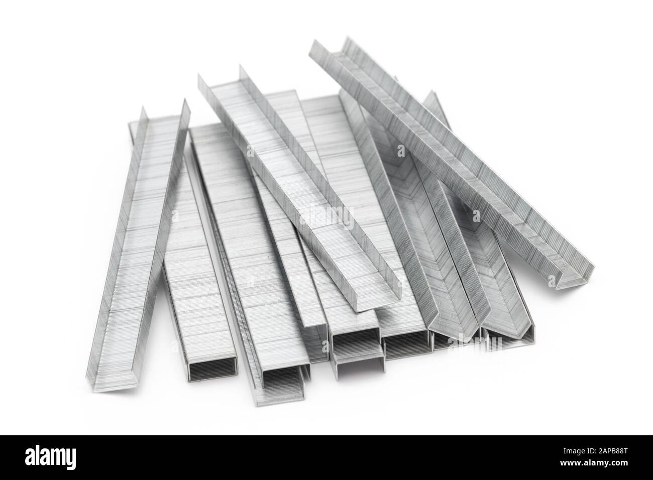 Pile of staples on white background Stock Photo - Alamy