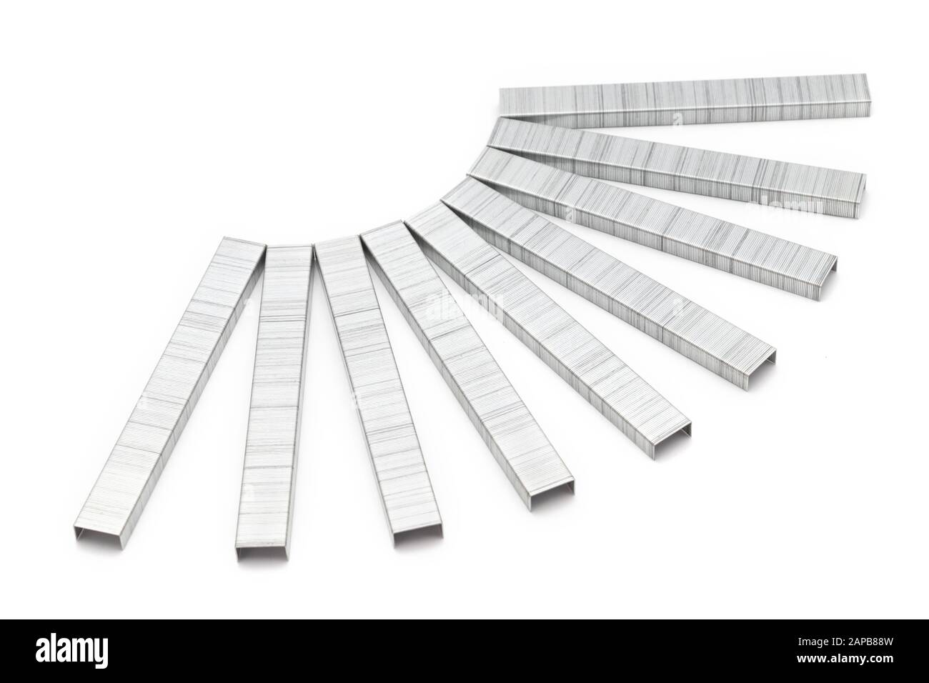 Rows of staples on white background Stock Photo - Alamy