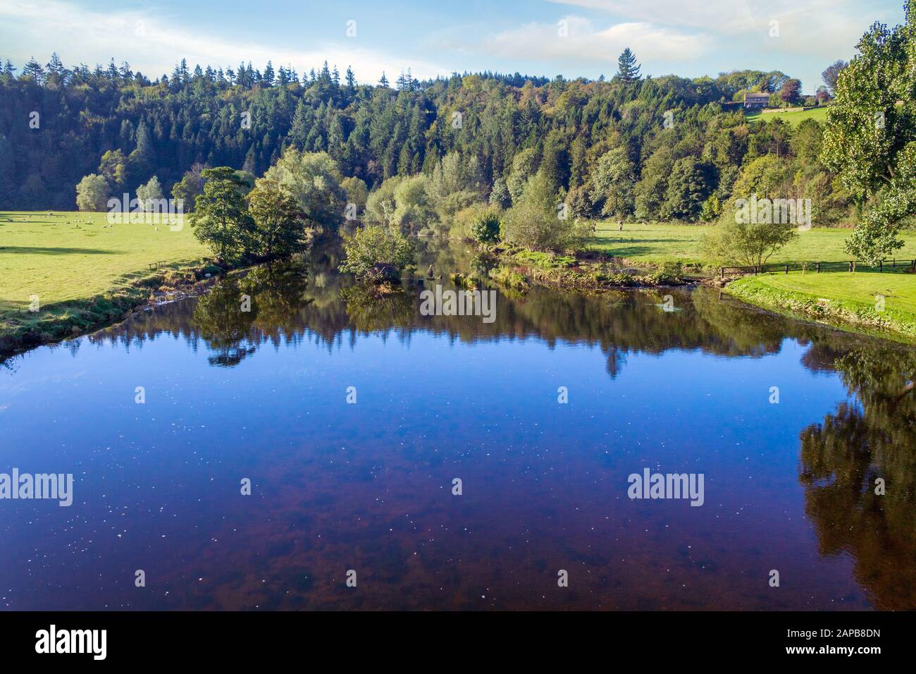 The landscape of a river and green forest in rural countryside in ...