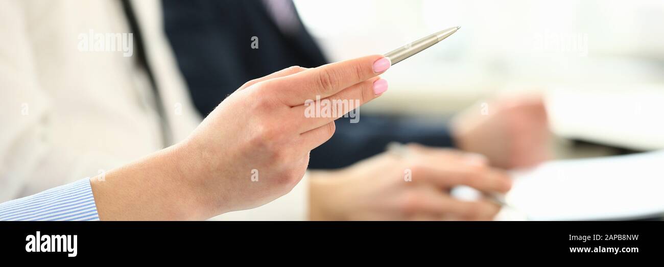 Gorgeous woman with pen Stock Photo - Alamy
