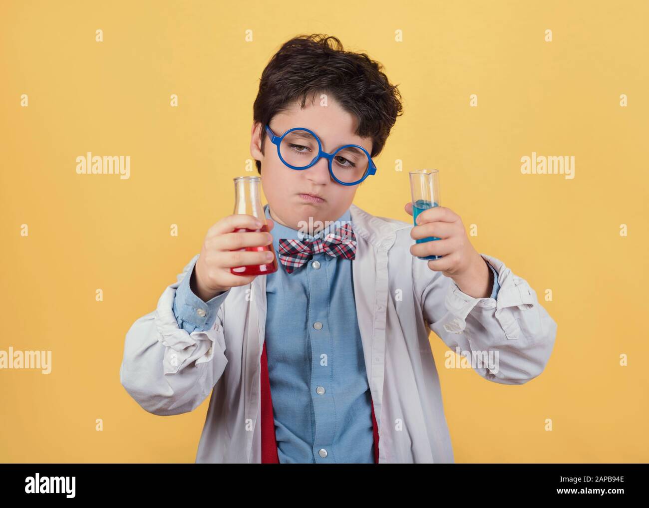 child scientist in laboratory on yellow background Stock Photo - Alamy