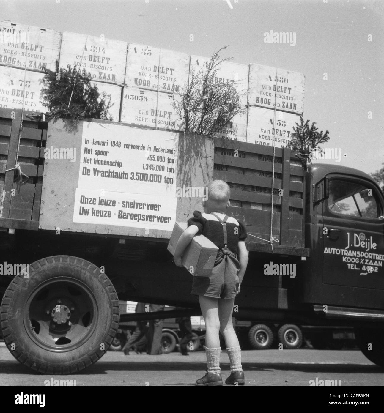 Demonstration of professional transport Annotation: Boy with box under ...