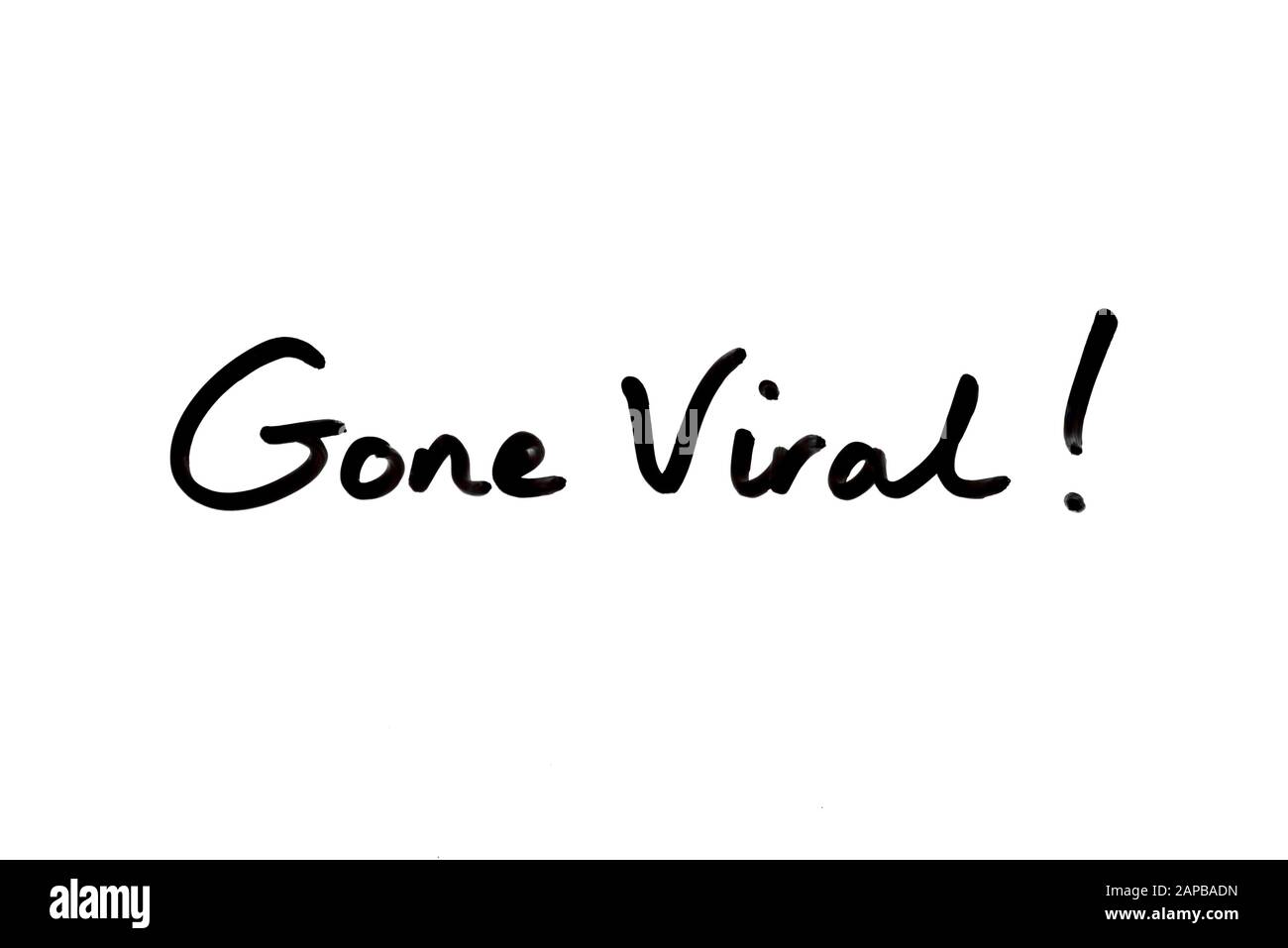 Close-up of the phrase Gone Viral! handwritten on a white background ...