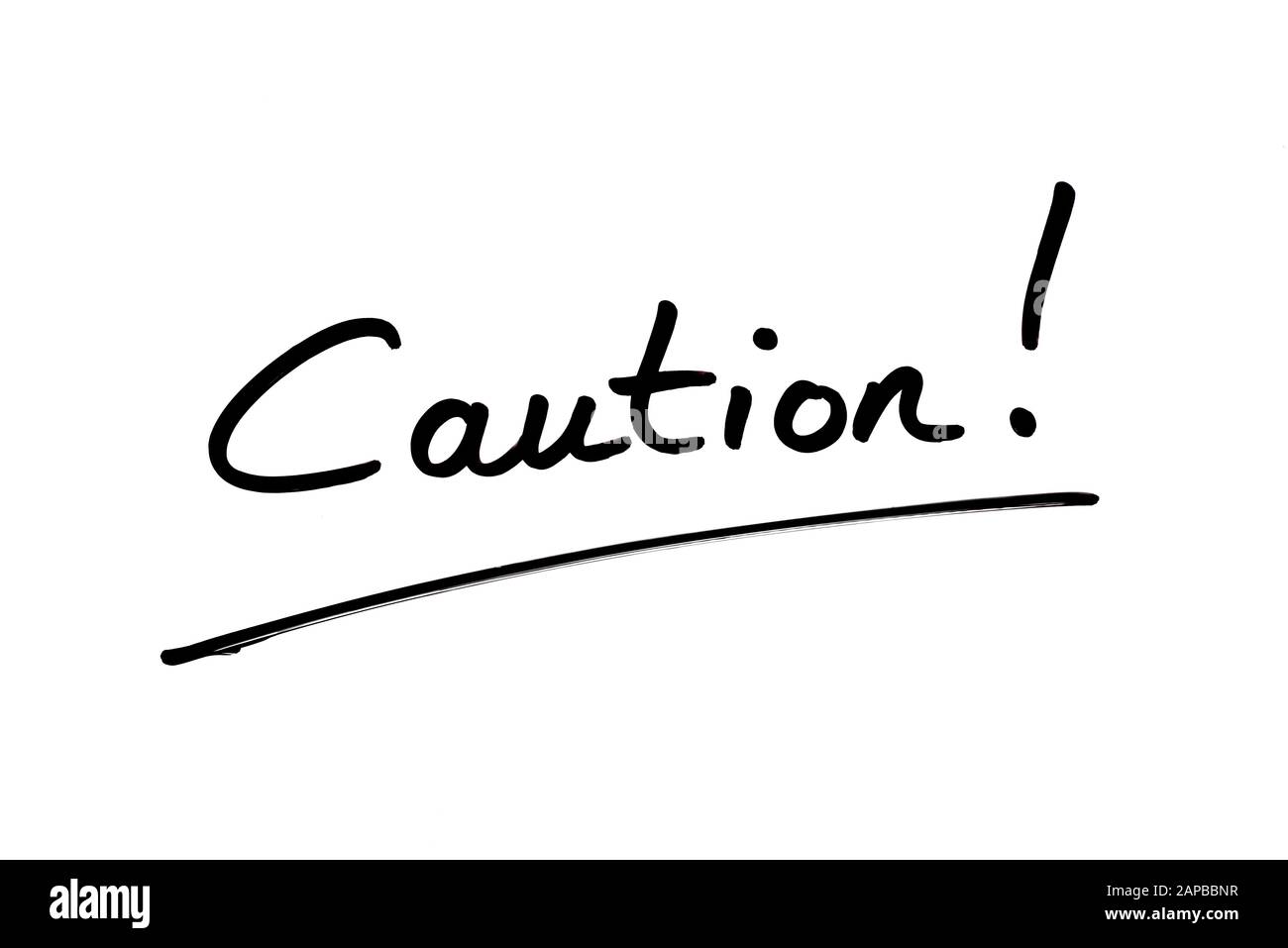 Caution! handwritten on a white background Stock Photo - Alamy