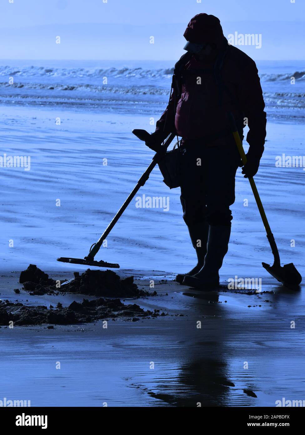 Metal Detecting on a Somerset beach in UK Stock Photo - Alamy