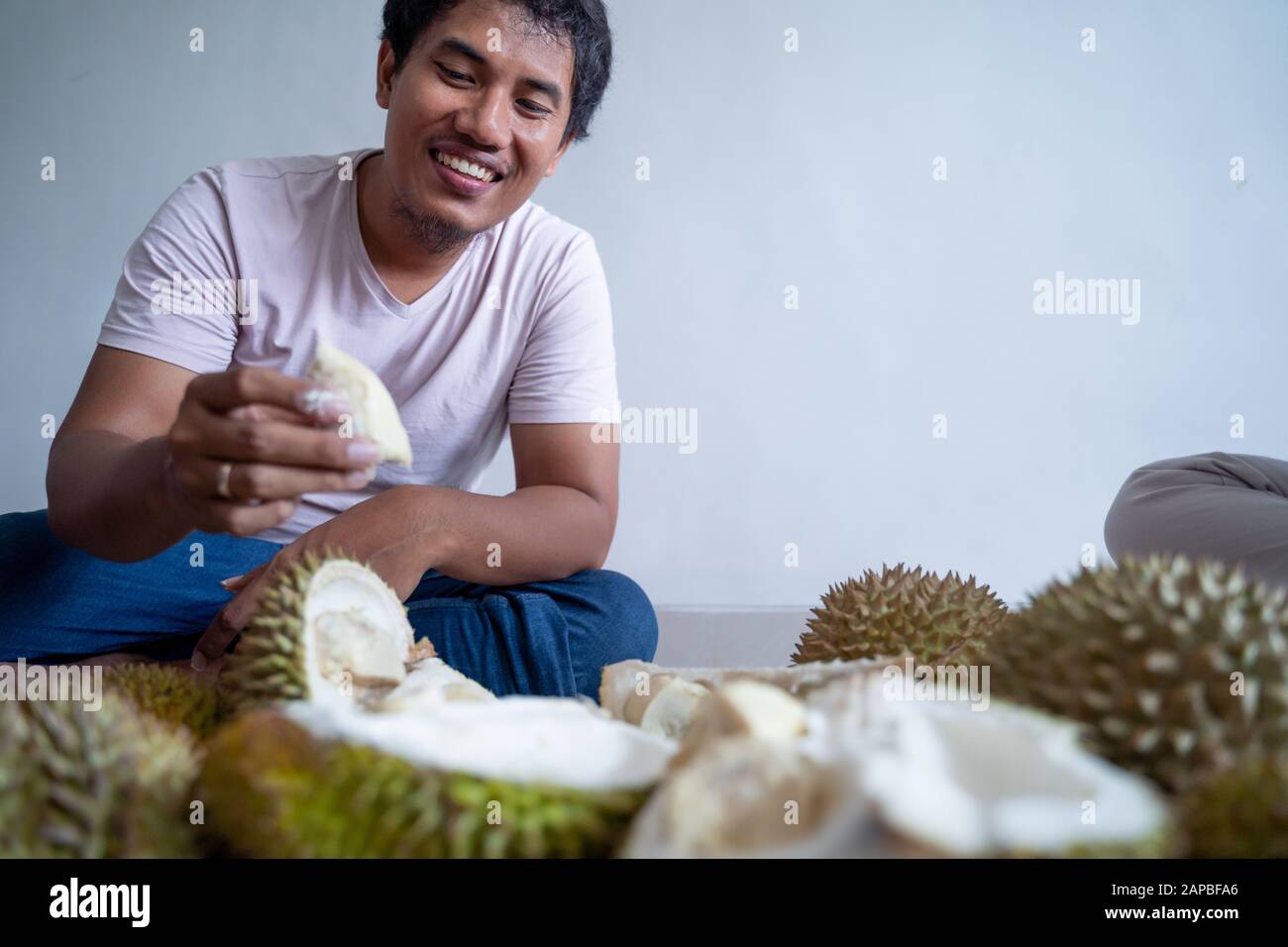 Asian people eating durian hi-res stock photography and images - Alamy