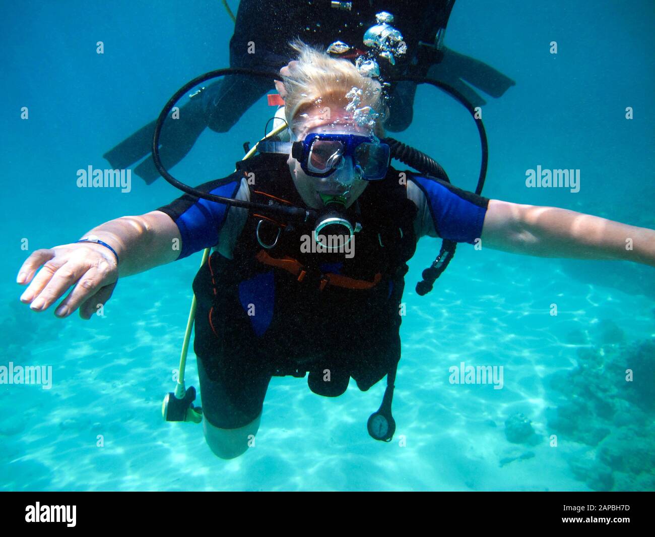 Woman scuba diver and beautiful colorful coral reef underwater Stock ...