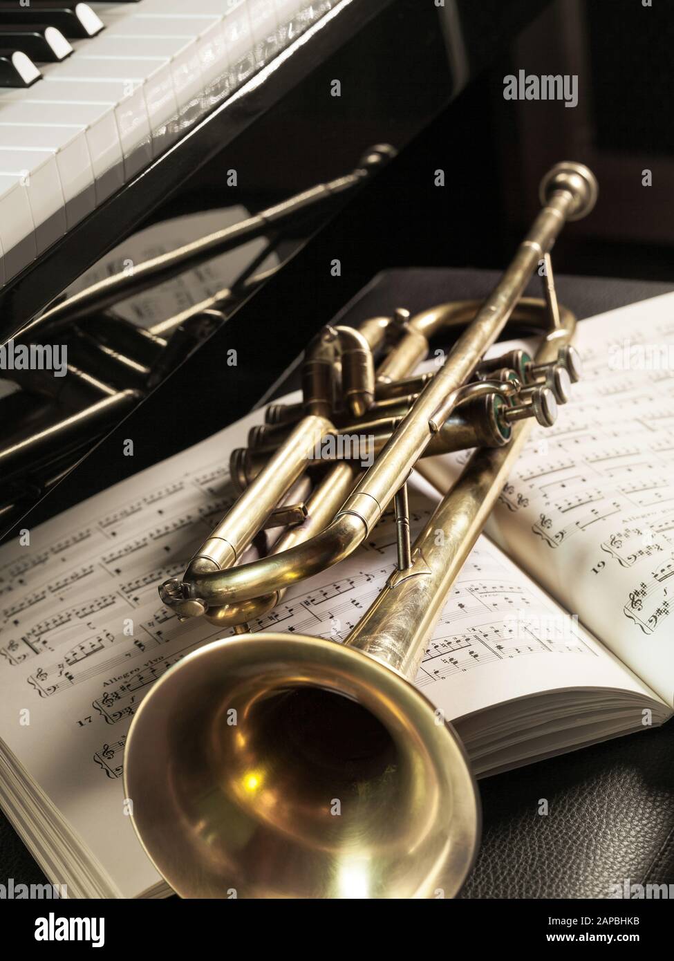old brass trumpet with sheet music Stock Photo - Alamy