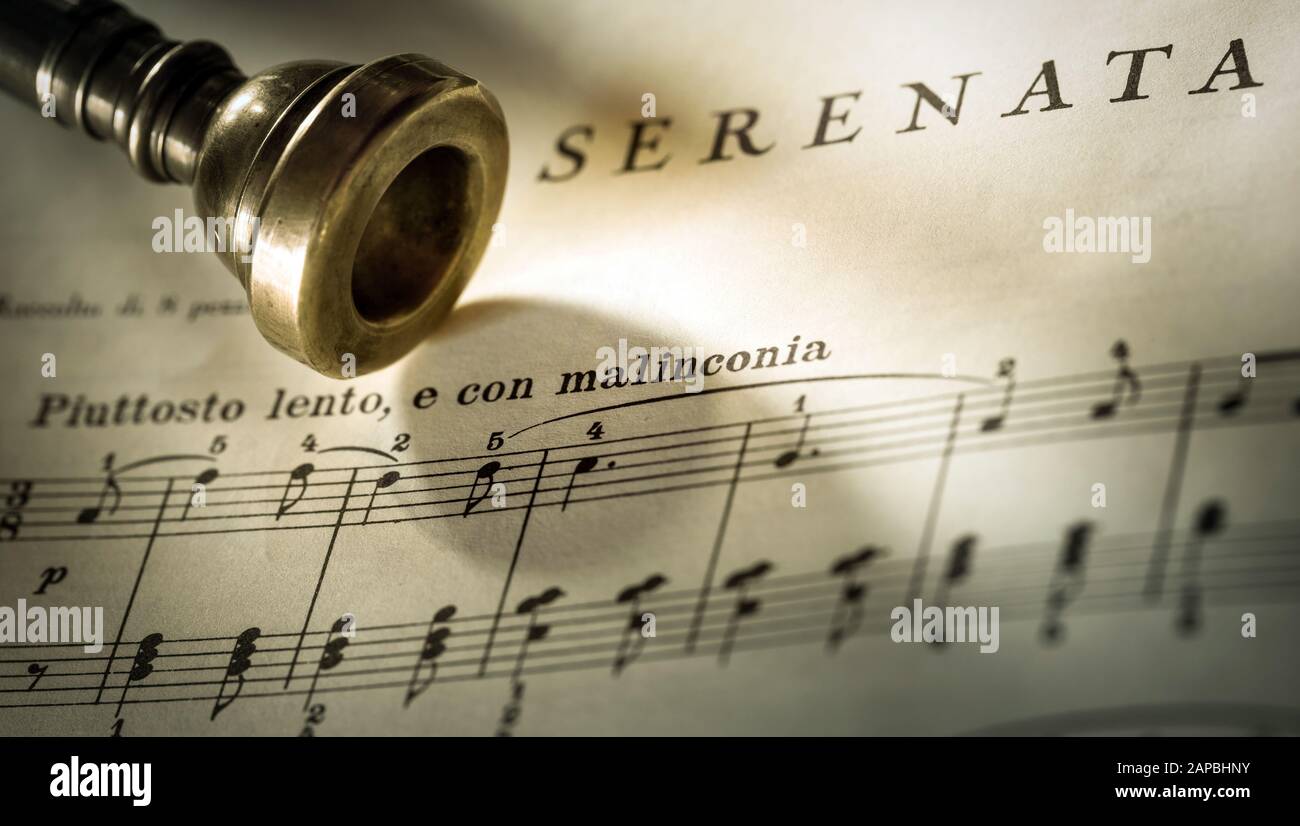 old brass trumpet with sheet music Stock Photo - Alamy