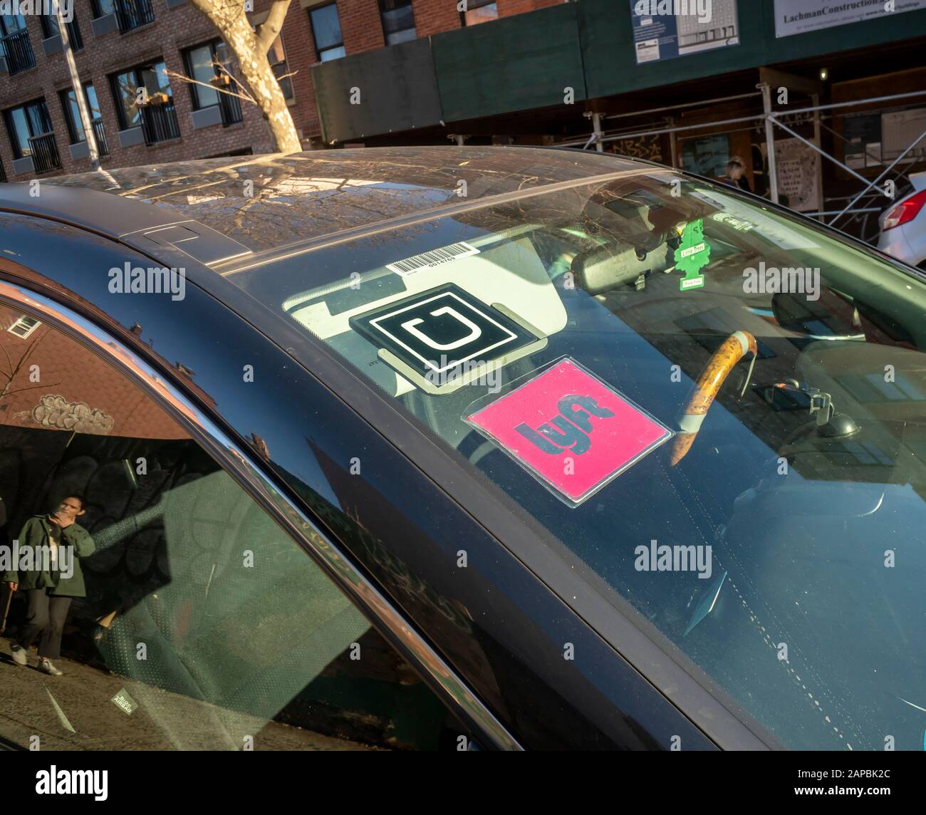 A livery with affiliation stickers for both competing Lyft and Uber in ...