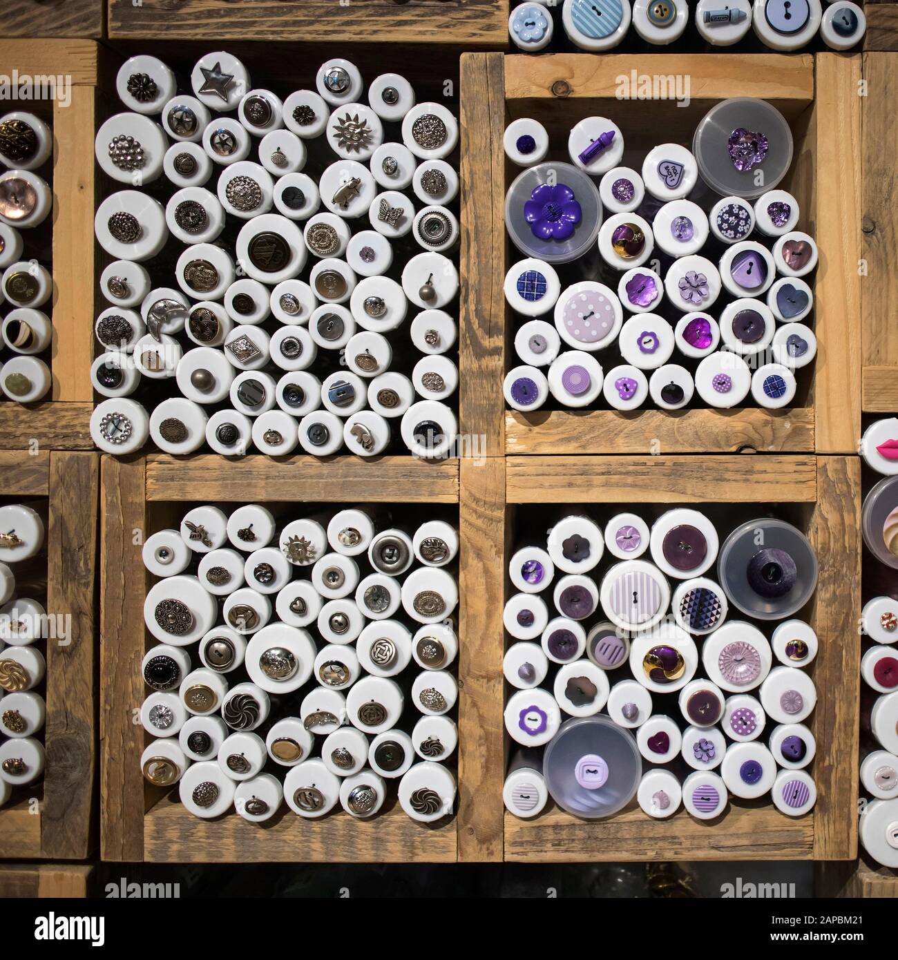 Multi-colored buttons in wooden boxes for sale in a store Stock Photo ...
