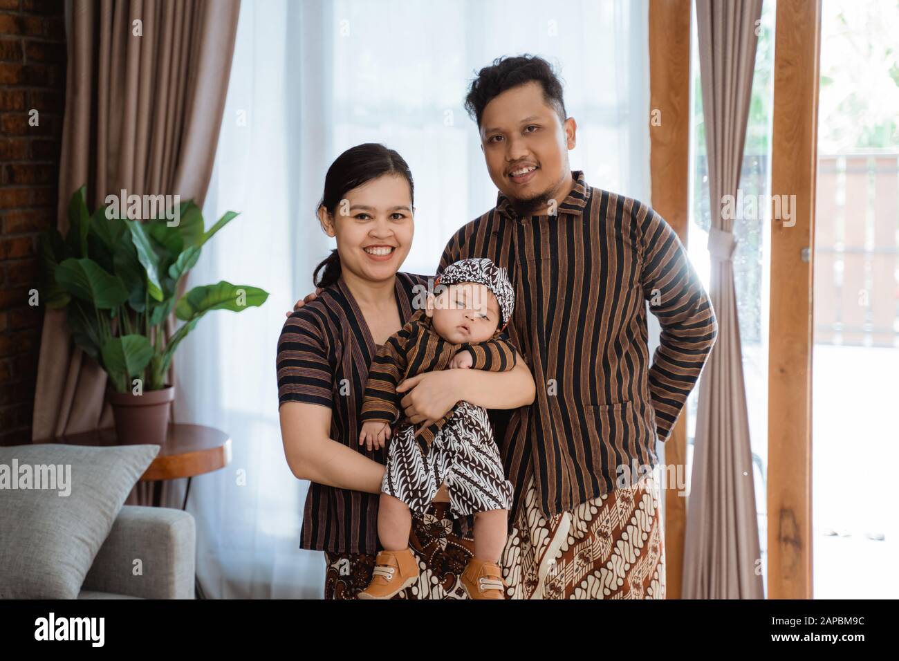 Indonesian family wearing javanese batik heritage with little son Stock ...