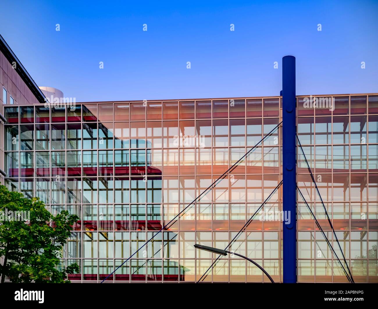 Glass transition between two parts of a modern office building in ...