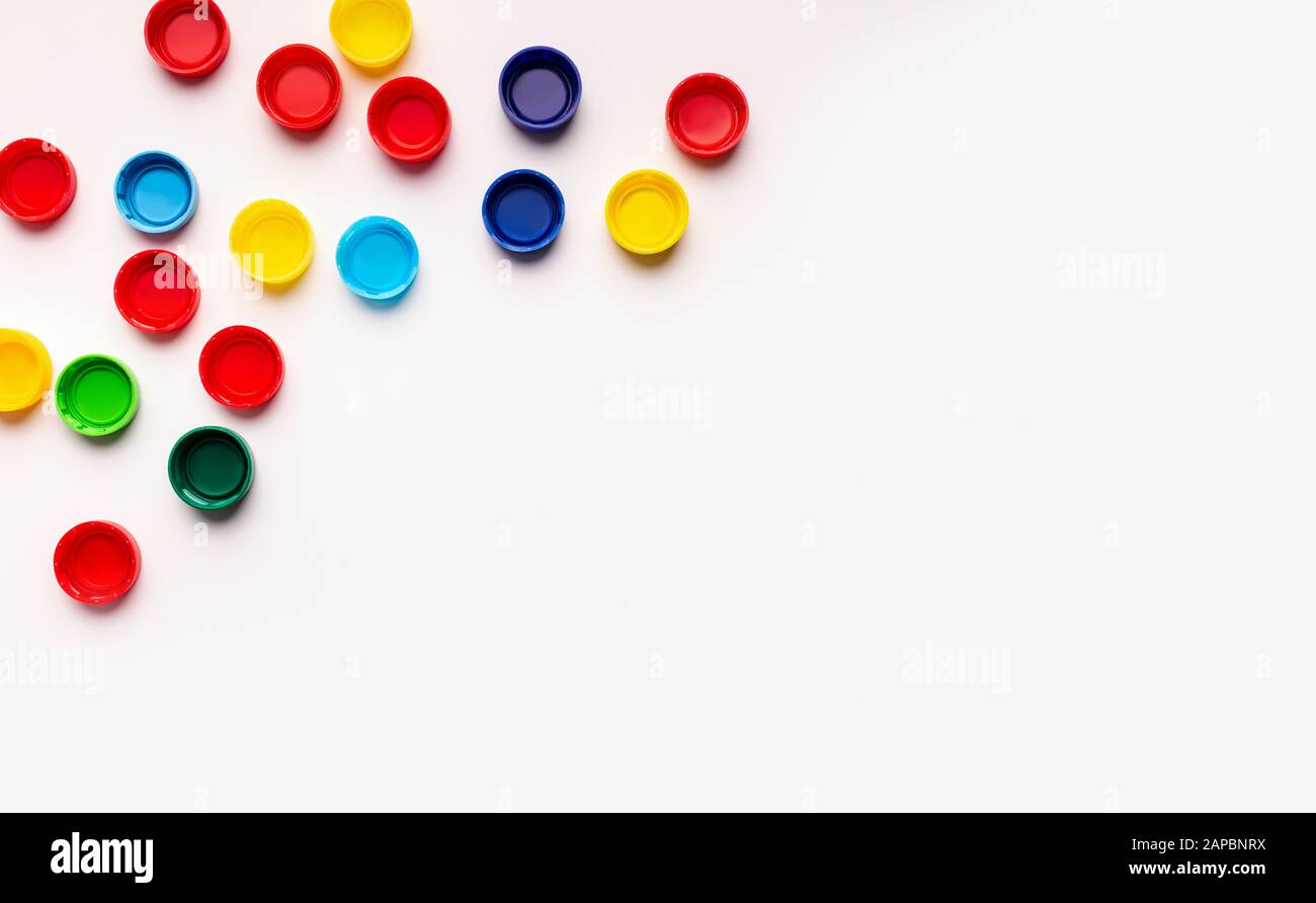 Colored frame plastic covers from bottles isolated on white Stock Photo ...