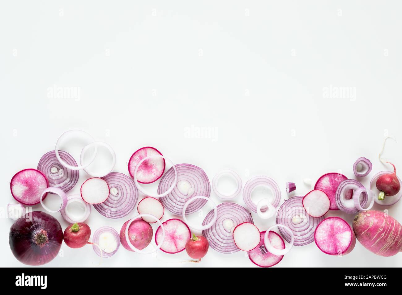 A top down view of a border arrangement of overlapping red onion ...