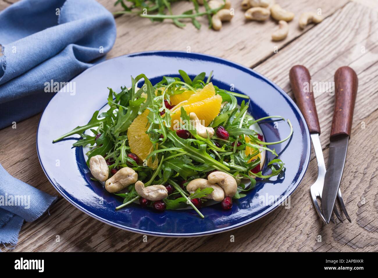 Vegan plant based salad with fresh leaf vegetables, arugula, orange ...