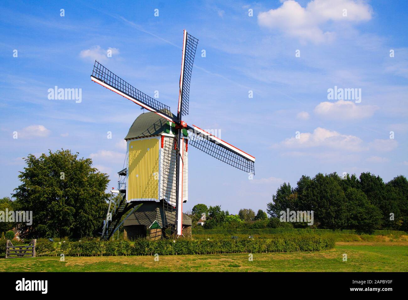 View on typical isolated dutch windmill against blue sky built in the ...