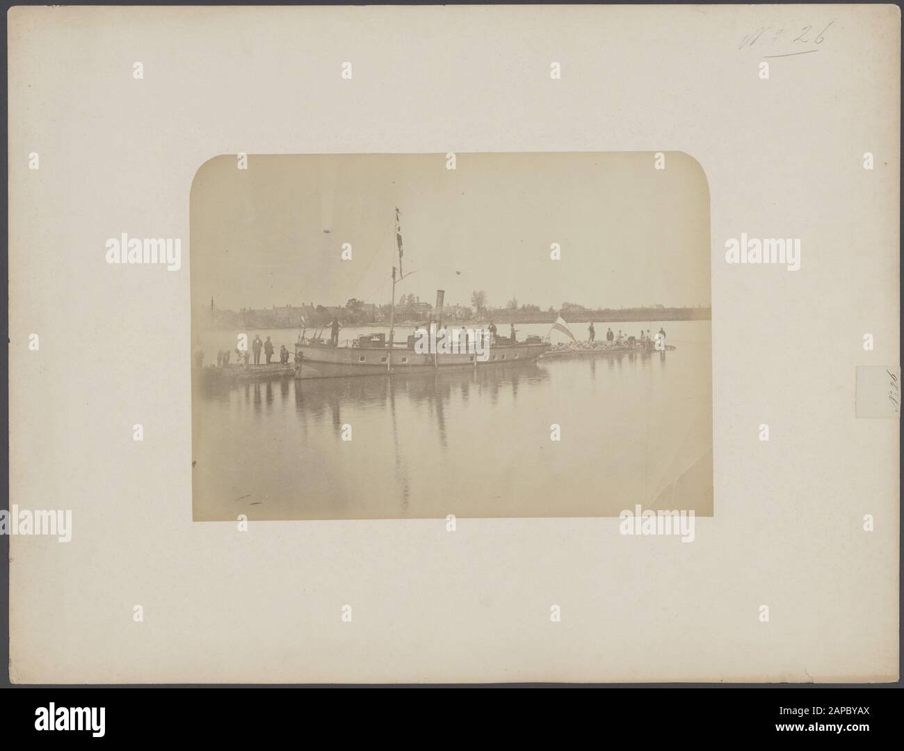 Construction of a dam in a river using a work ship with steam drive ...