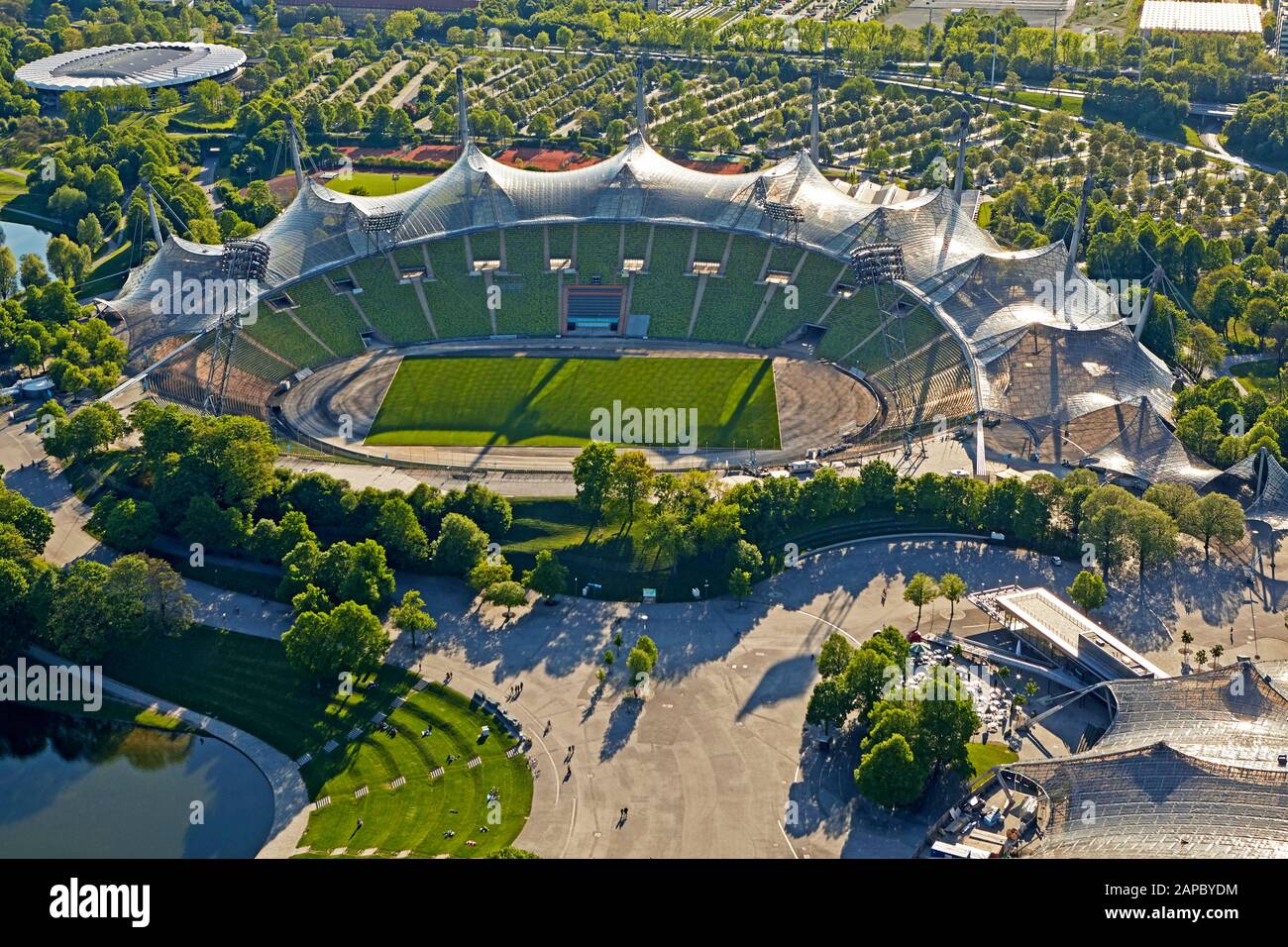 Aerial view of Munich Olympic stadium in the Olympic park at sunset ...