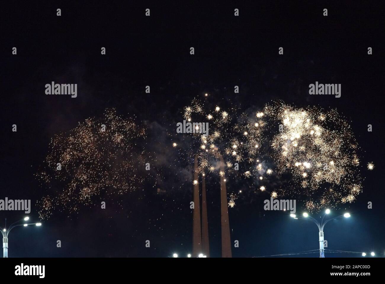 Small explosions of fireworks on a holiday in the city Stock Photo - Alamy