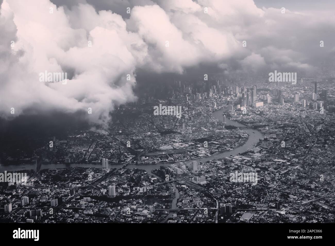 Heavy storm clouds looming over Bangkok, Thailand. Black and white ...