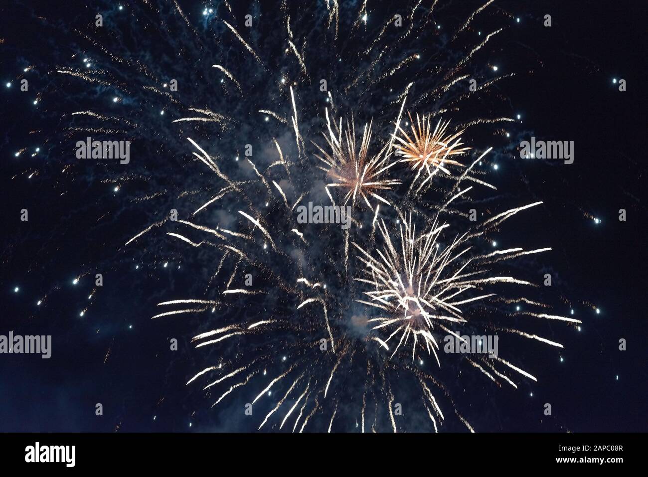 Fireworks, with many explosions, and tracers. With blue smoke Stock ...