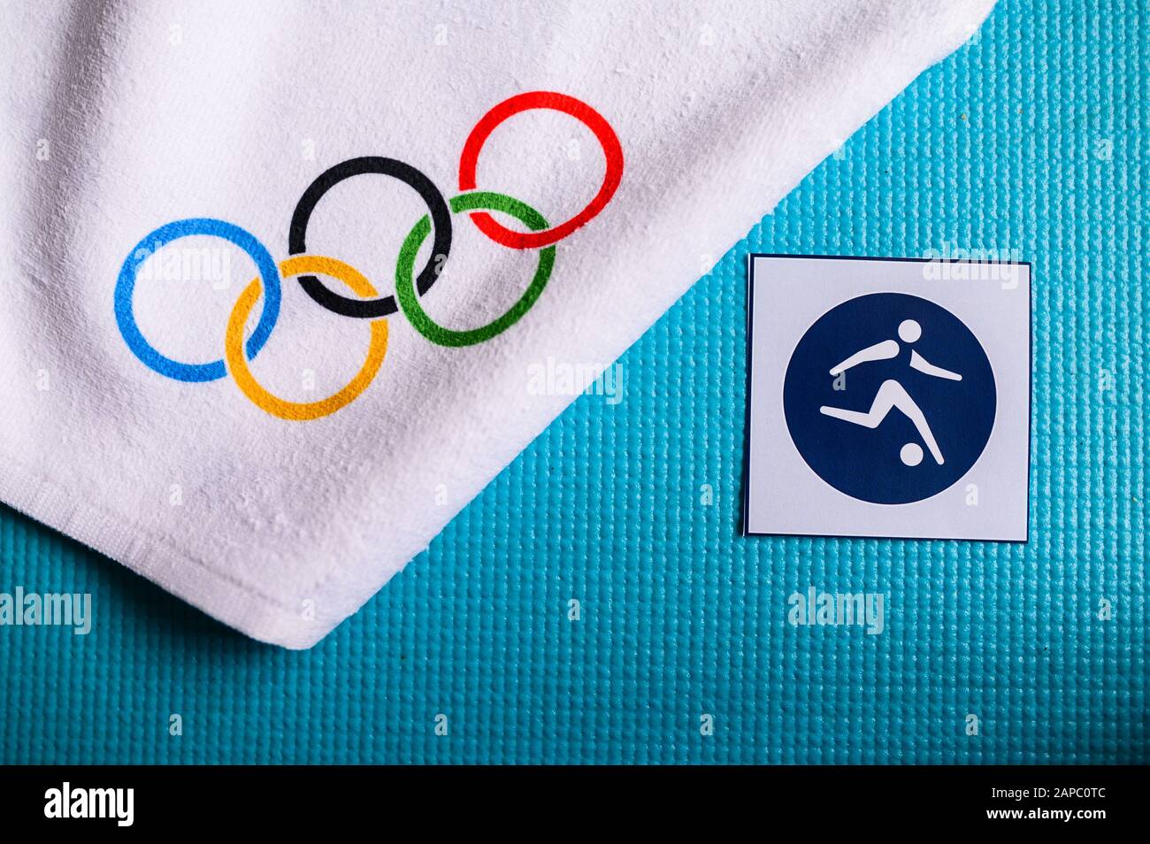 TOKYO, JAPAN, JANUARY. 20. 2020: Football pictogram and olympic rings ...
