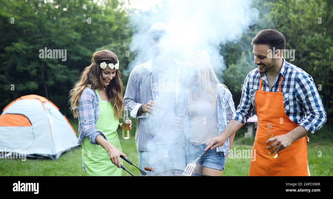 Friends spending time in nature and having barbecue Stock Photo - Alamy